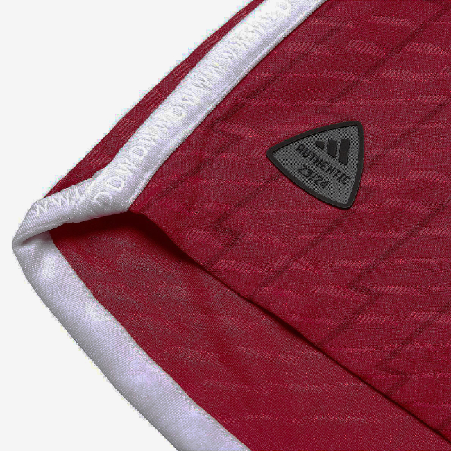 A photo of Arsenal’s 2023-24 home kit, altered to better show the ...