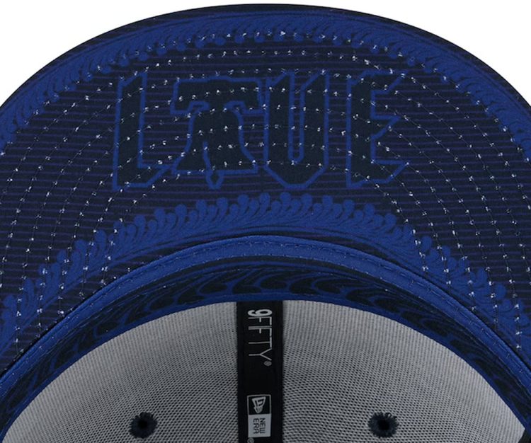 The undervisor and interior sweatband of the cap both contain designs ...