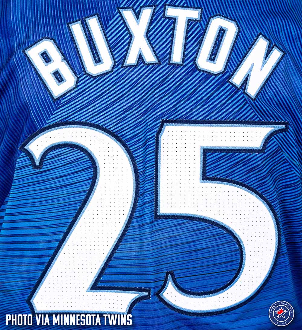 White name and numbers on the back, wave-inspired embellishment on the ...