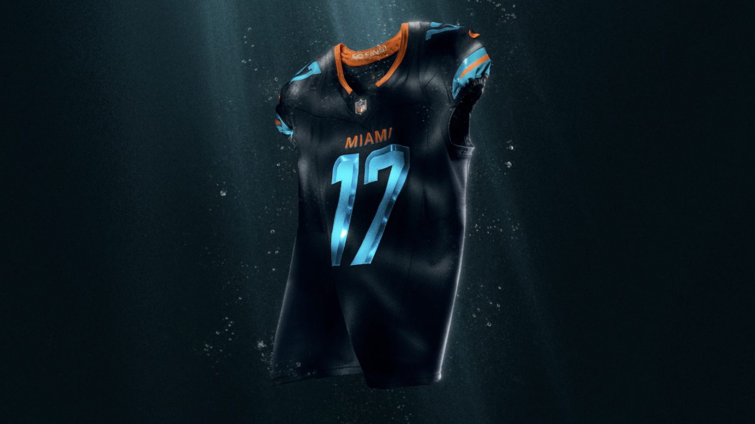 The Dolphins revealed a dark navy blue uniform that features an orange “Miami” wordmark across ...